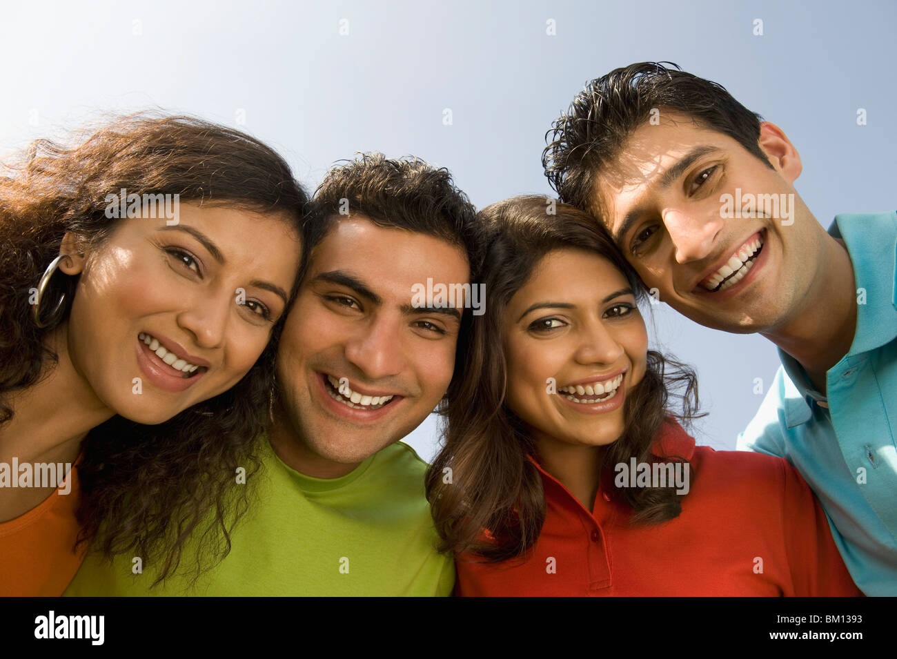 Portrait of four friends smiling Stock Photo - Alamy
