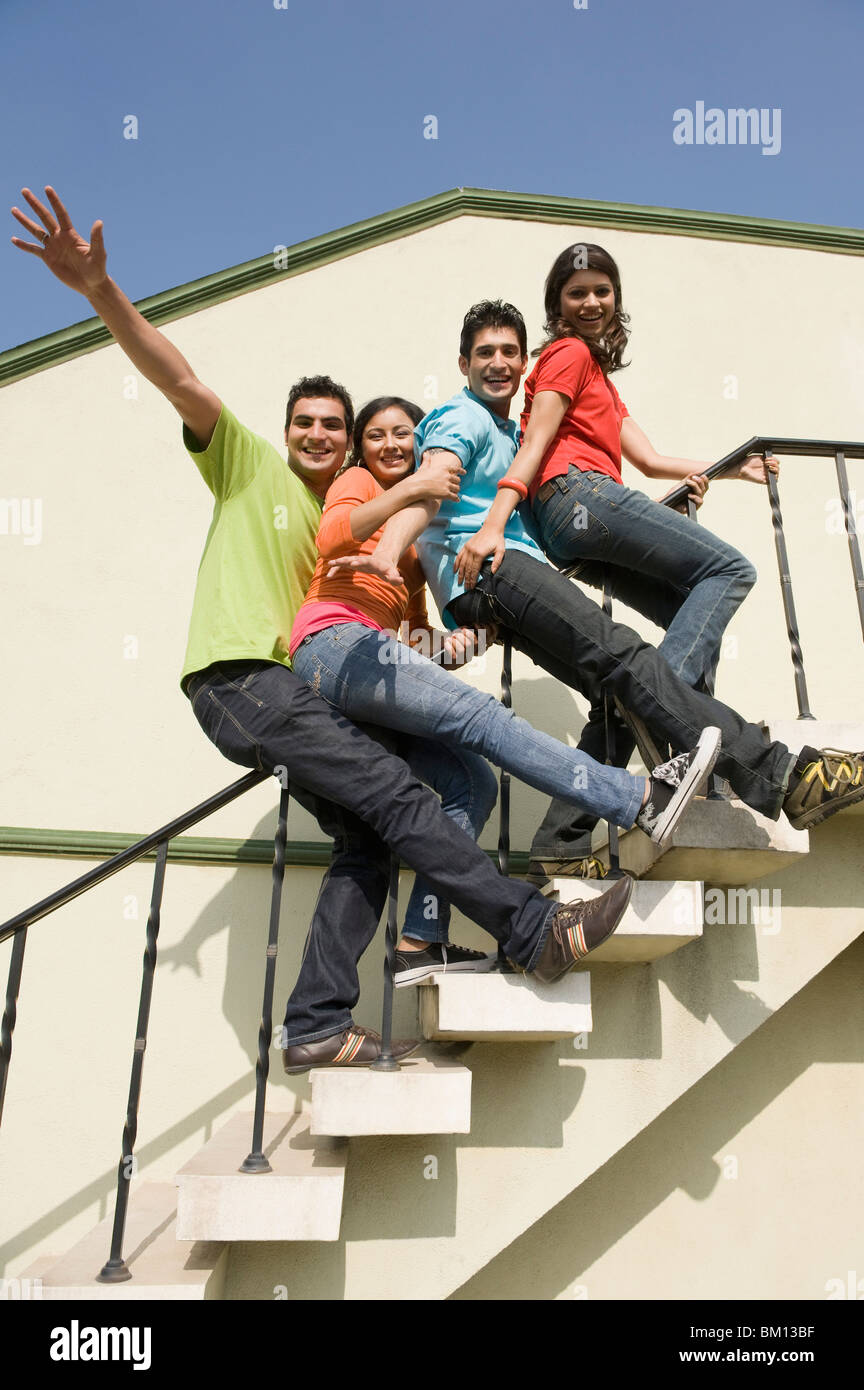 Friends playing on a staircase Stock Photo - Alamy