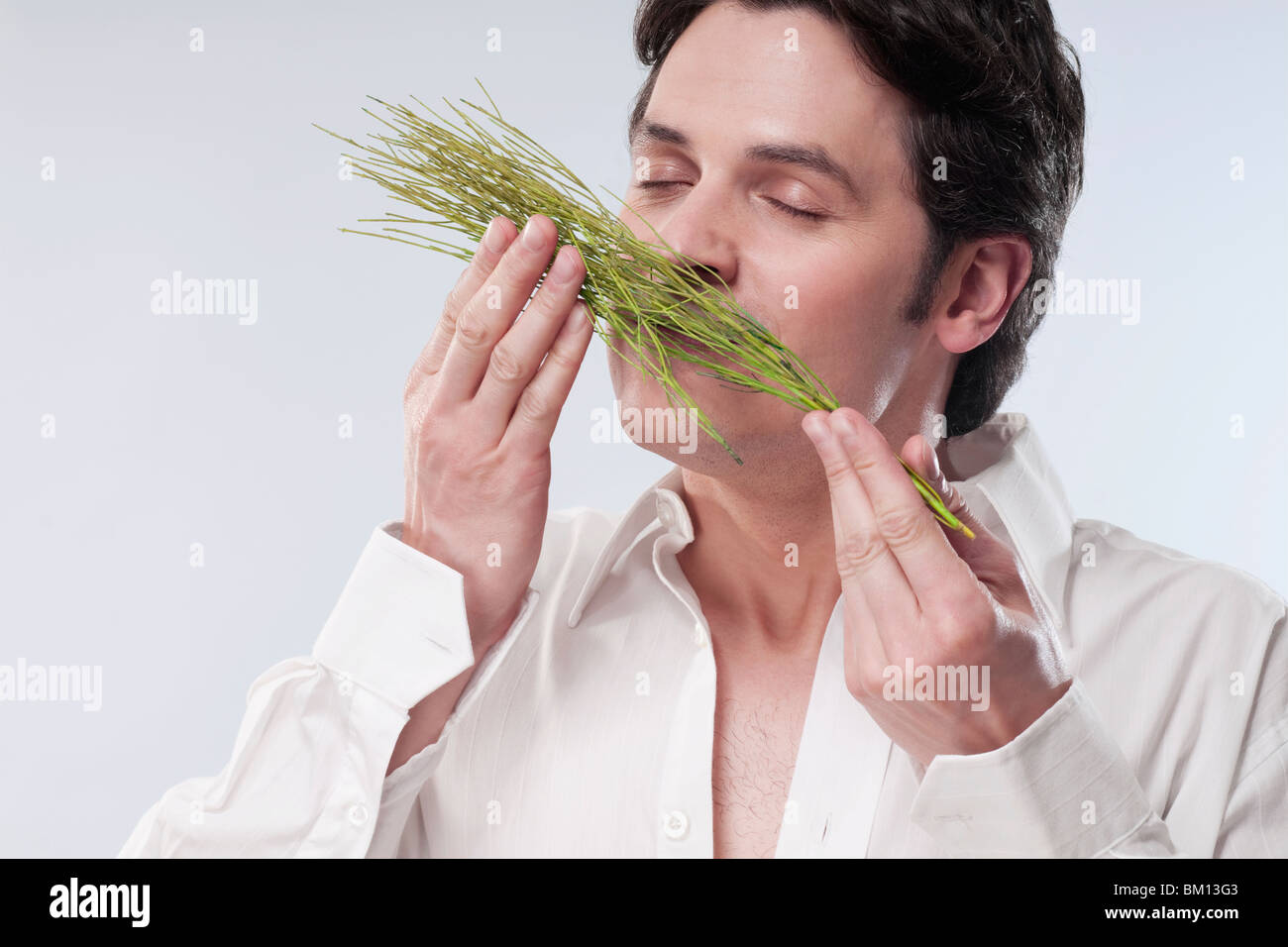 Man smelling aroma herbs Stock Photo - Alamy