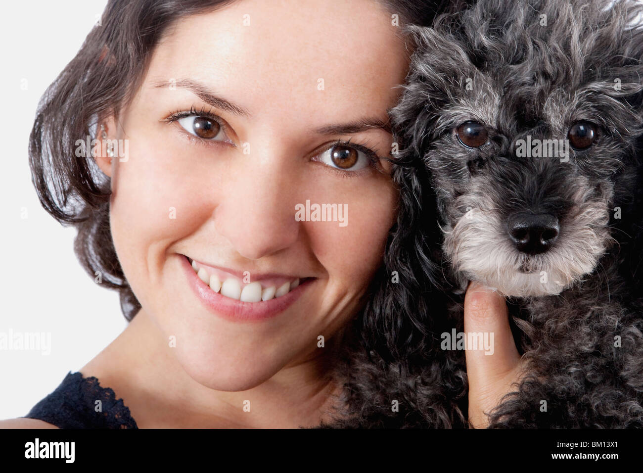 Portrait of a woman with a poodle Stock Photo - Alamy
