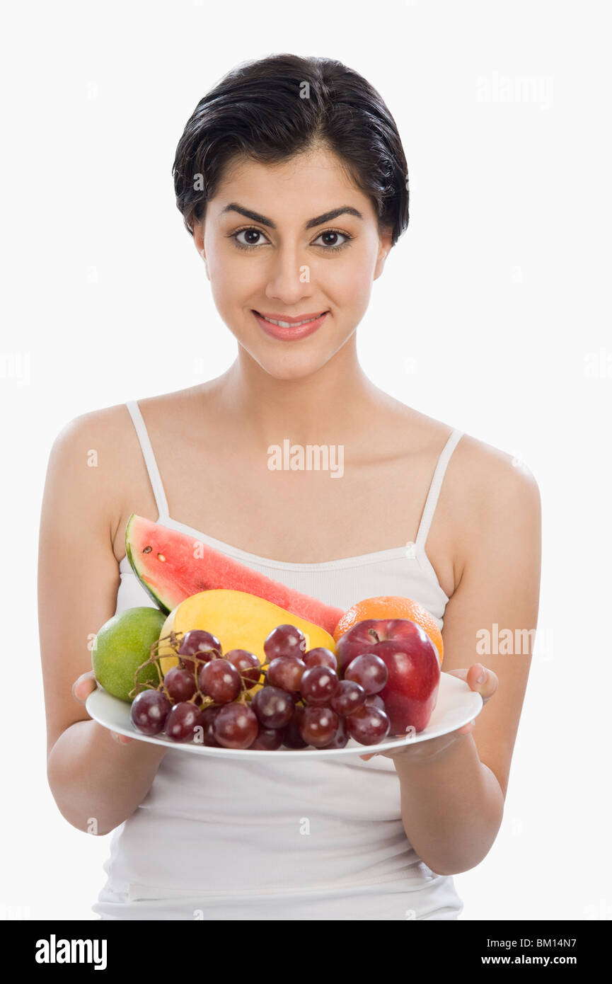 Smiling holding bunch fruits hi-res stock photography and images - Alamy