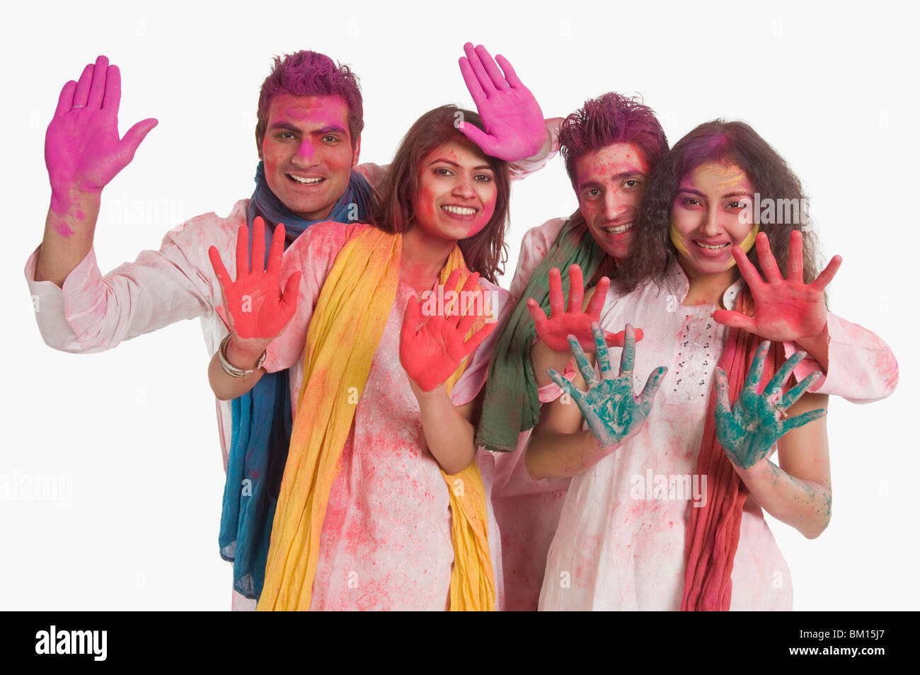 Friends celebrating Holi Stock Photo - Alamy