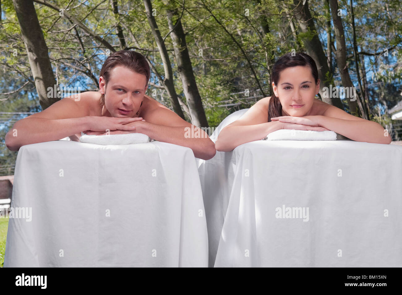 Couple lying on massage tables Stock Photo - Alamy