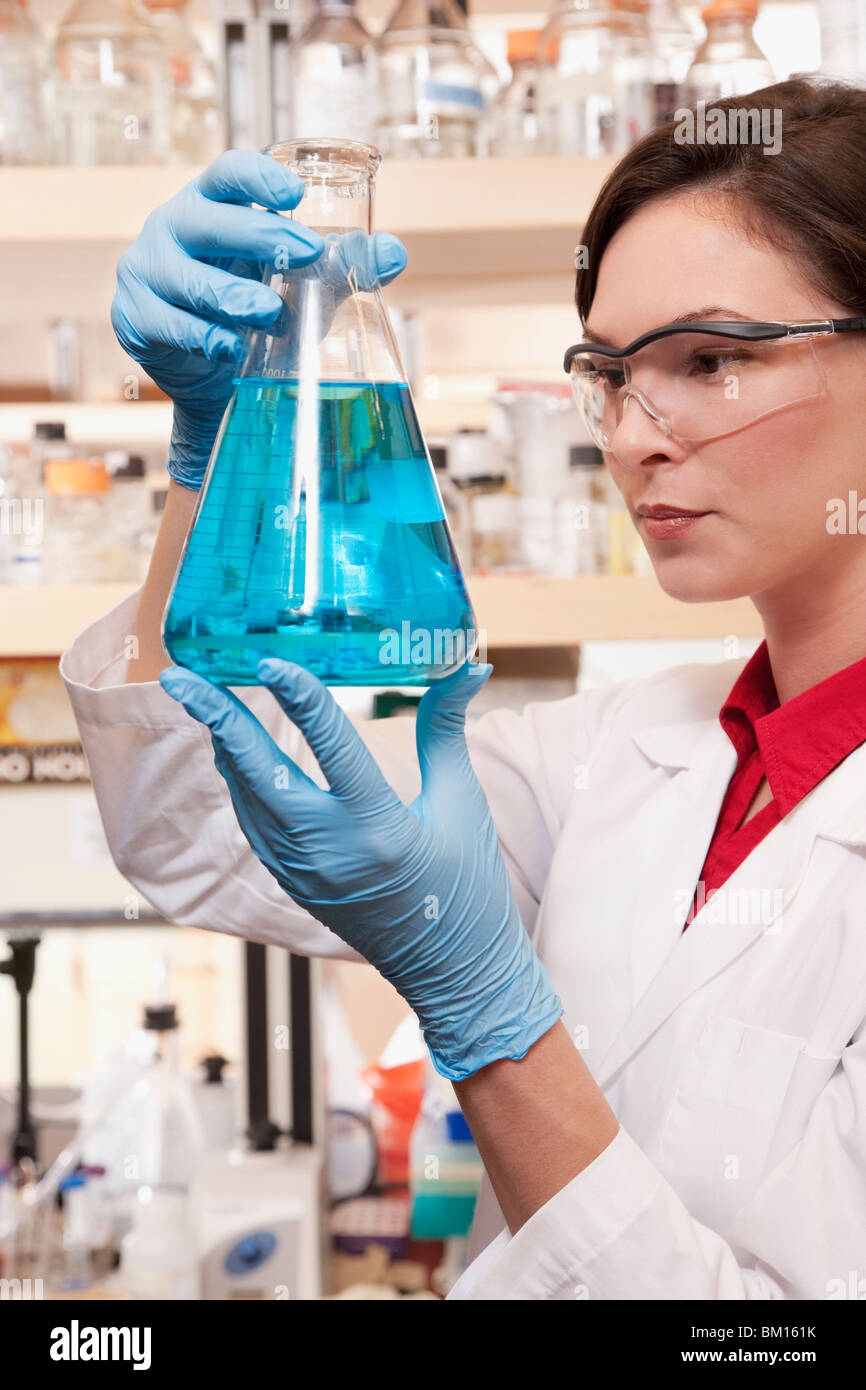 Female doctor holding a conical flask in a laboratory Stock Photo - Alamy