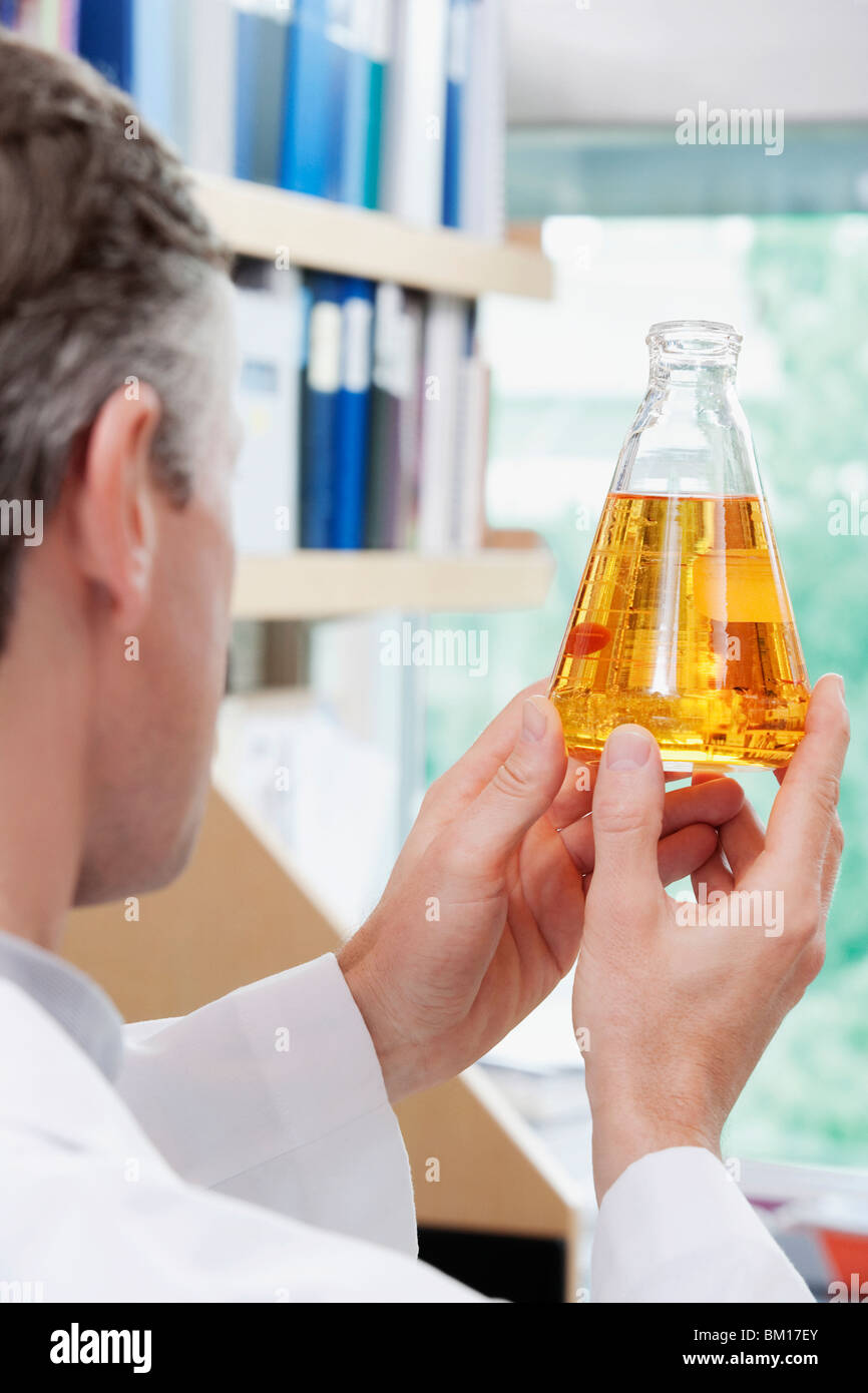 Doctor holding a conical flask in a laboratory Stock Photo - Alamy