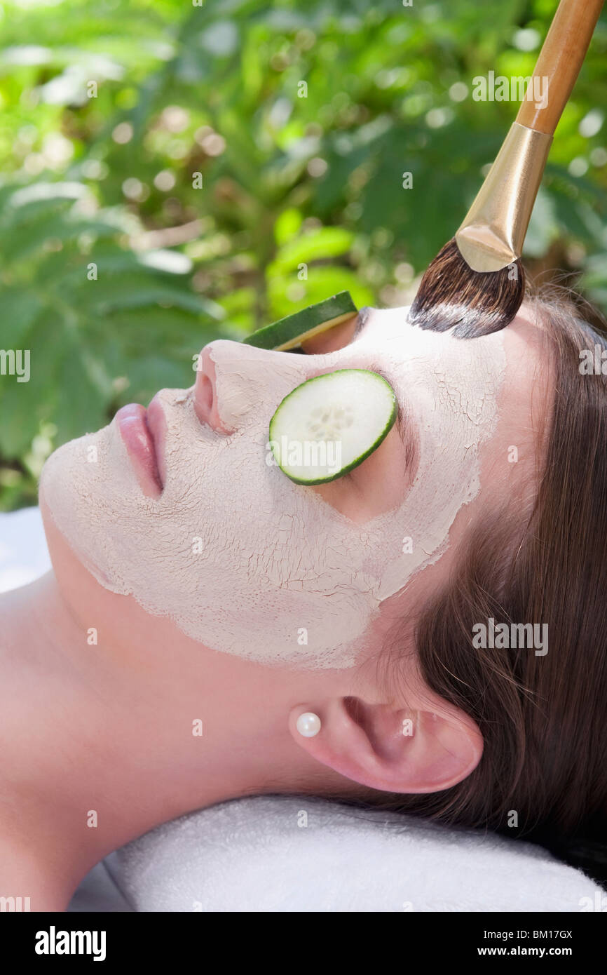 Woman applying a facial mask Stock Photo - Alamy