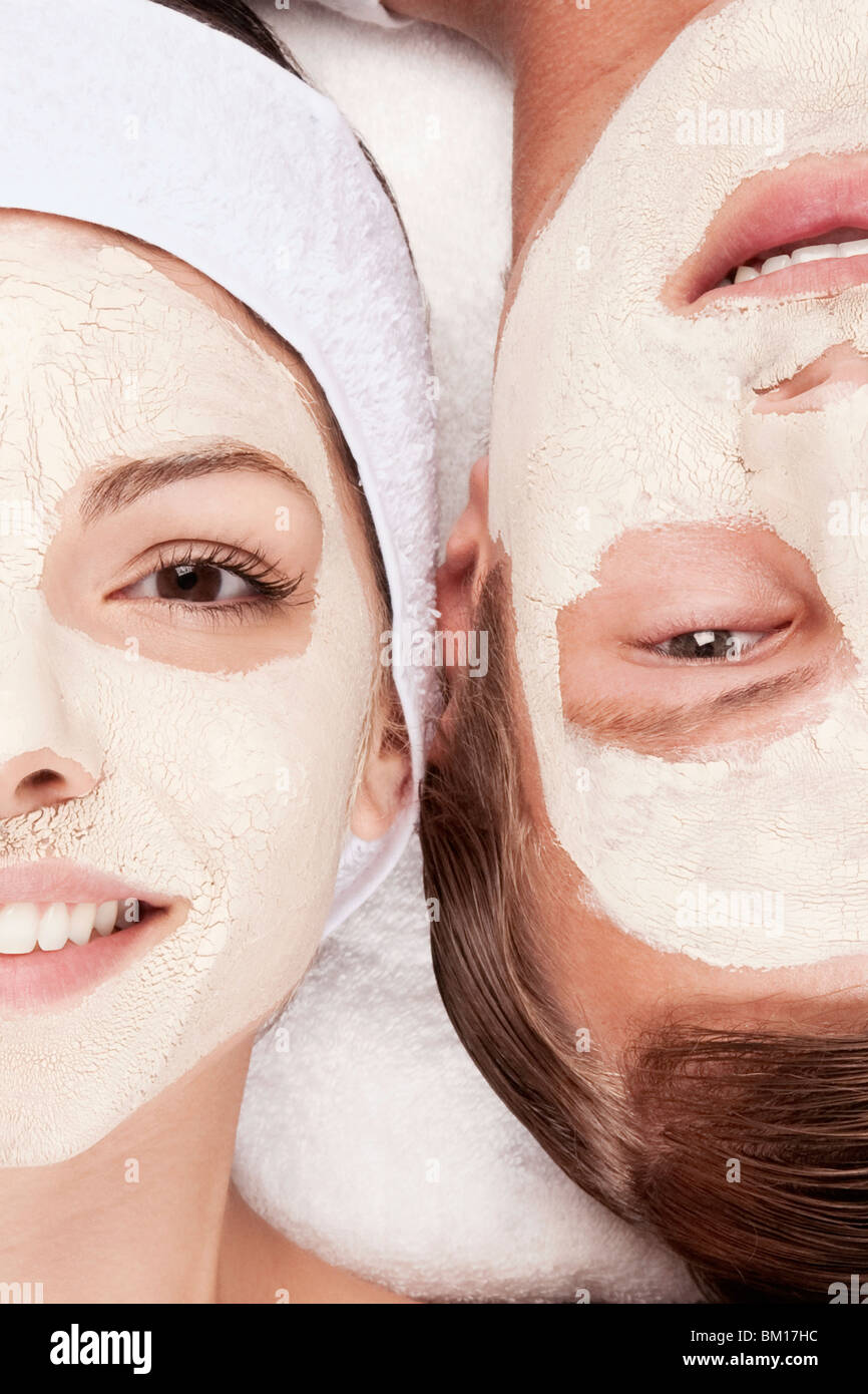 Couple with face pack on their faces Stock Photo - Alamy