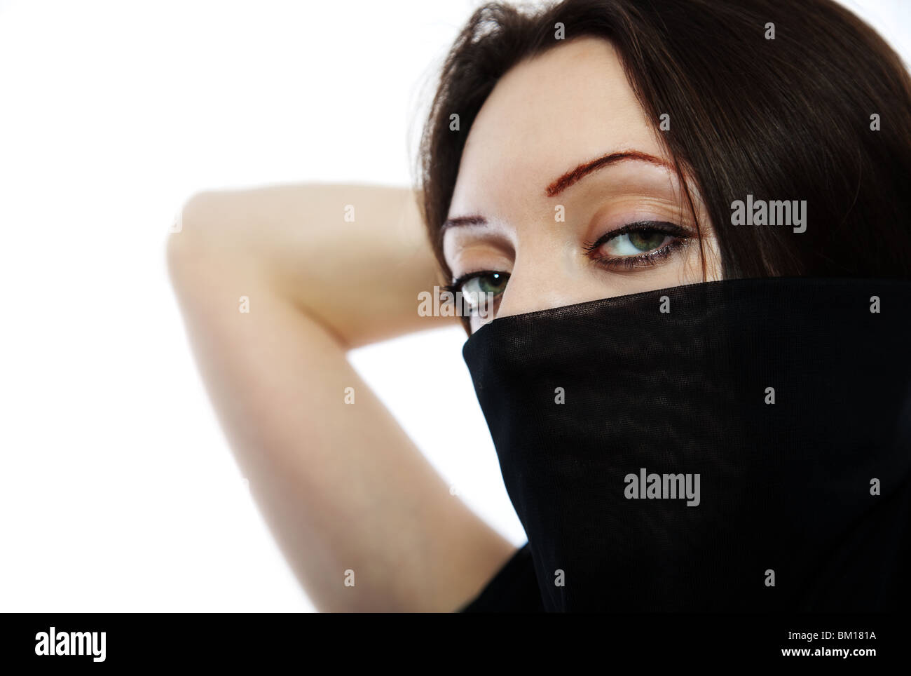 Model half of the face covered with a black transparent fabric, a ...