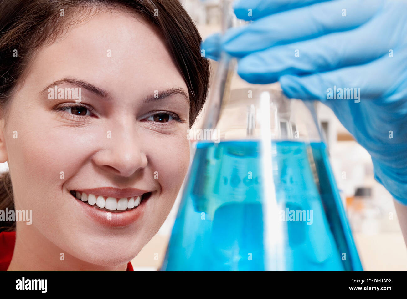 Female doctor holding a conical flask in a laboratory Stock Photo - Alamy