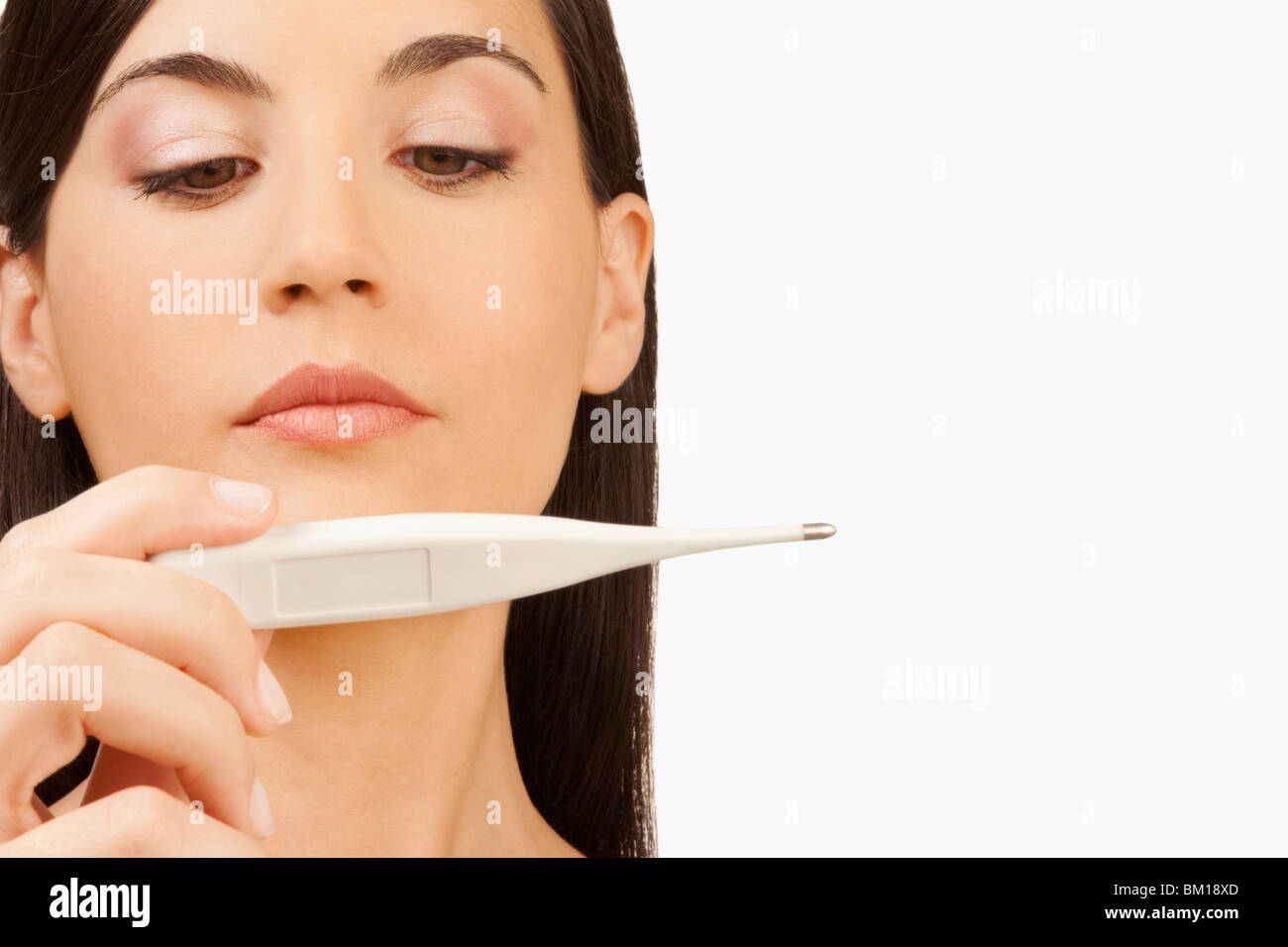 Woman reading a thermometer Stock Photo - Alamy