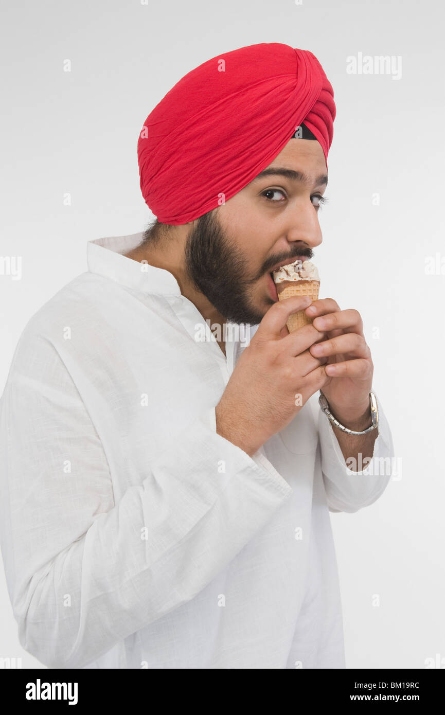 Portrait of a Sikh man eating ice cream Stock Photo - Alamy