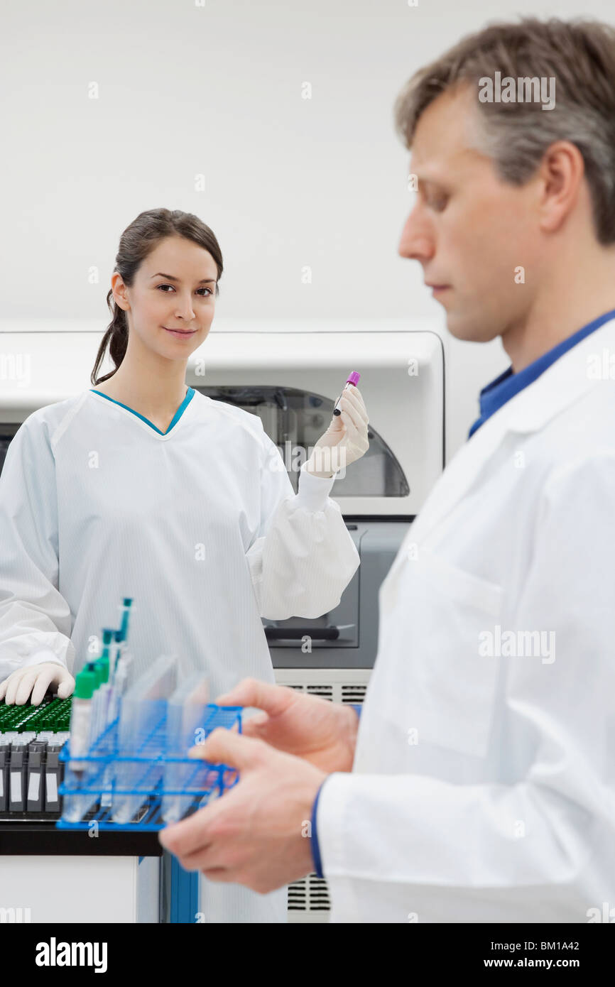 Female doctor holding a medical sample in a laboratory Stock Photo - Alamy
