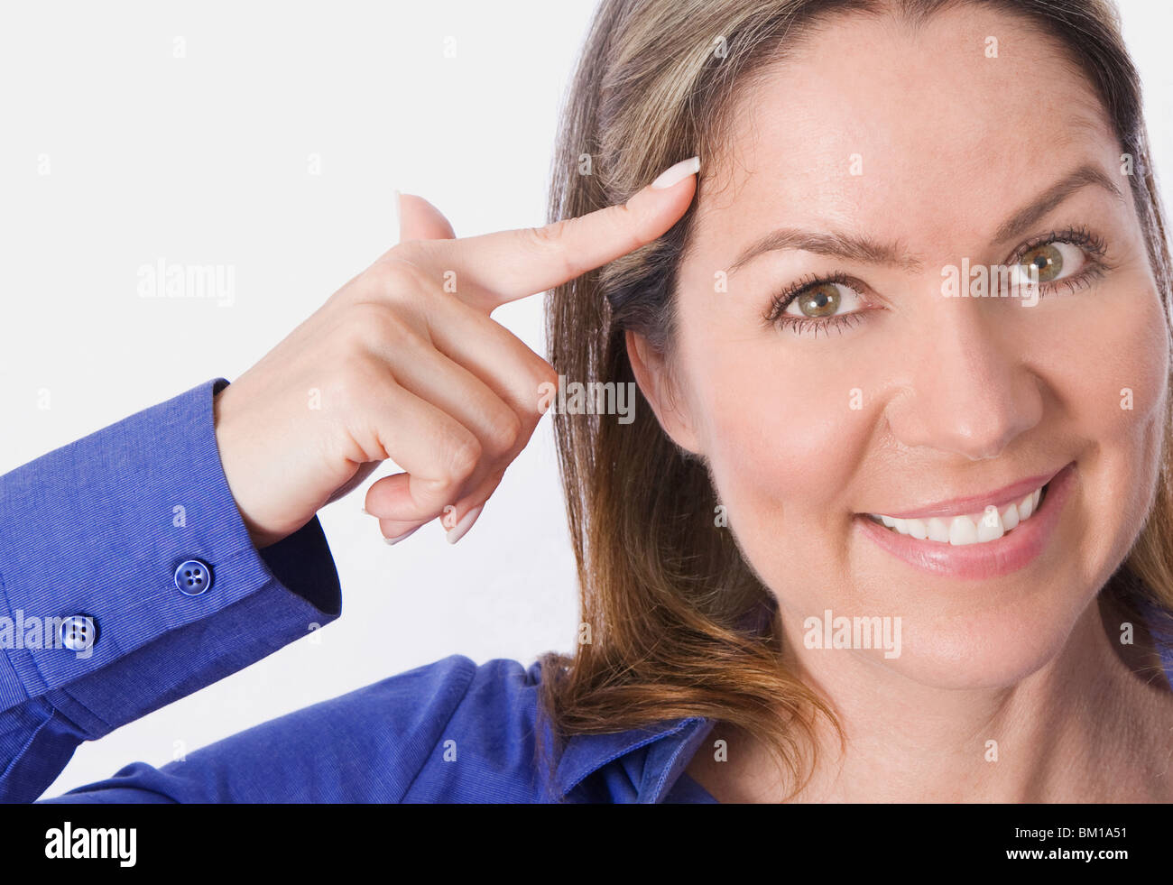 Hispanic female touching temple hi-res stock photography and images - Alamy