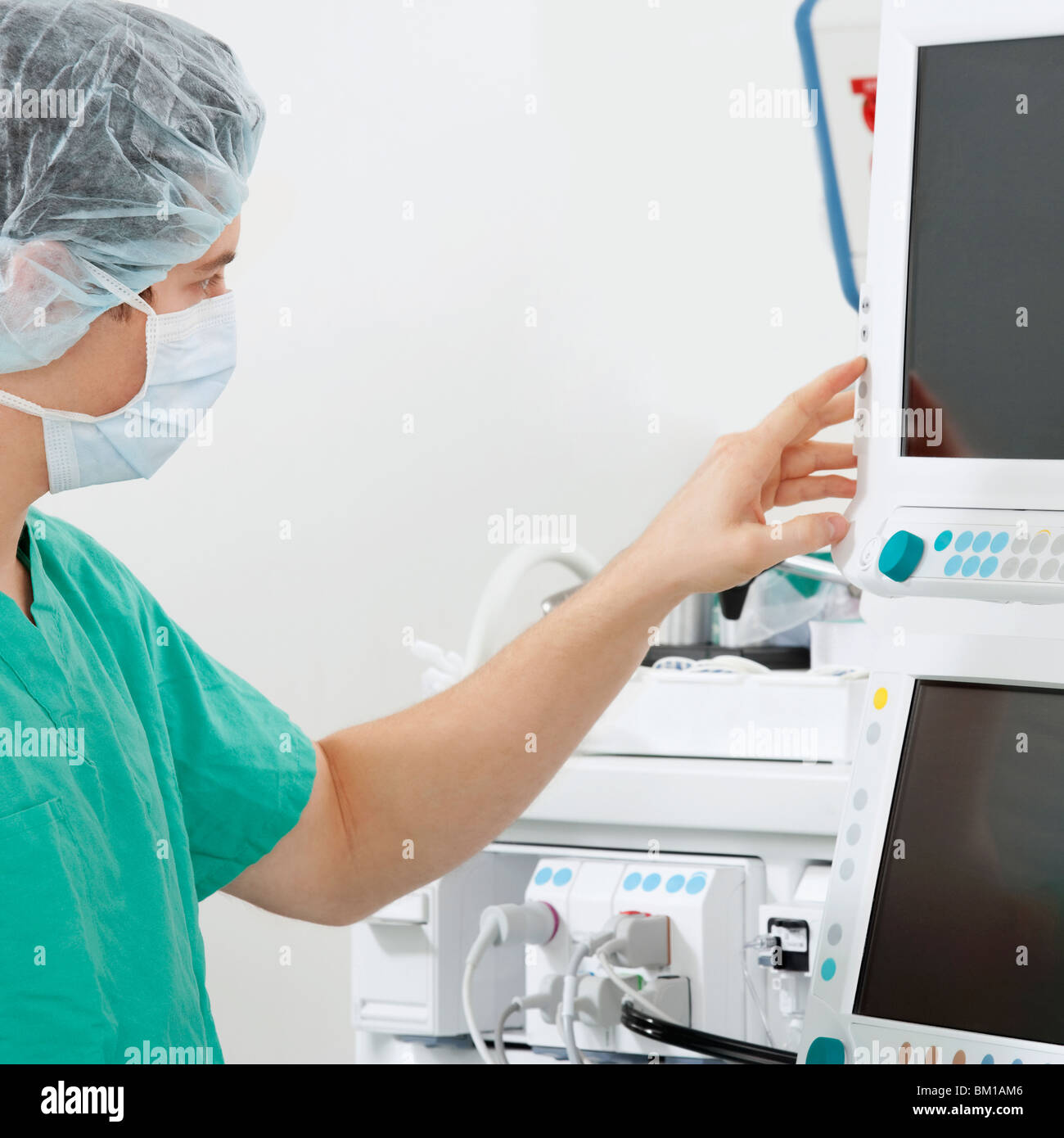 Doctor working on a cardiac monitor screen Stock Photo - Alamy