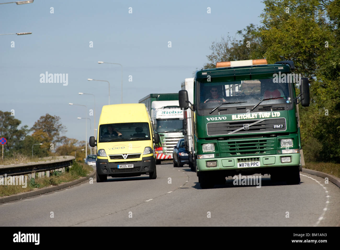 Van overtaking a lorry on a busy dual carriageway Stock Photo - Alamy