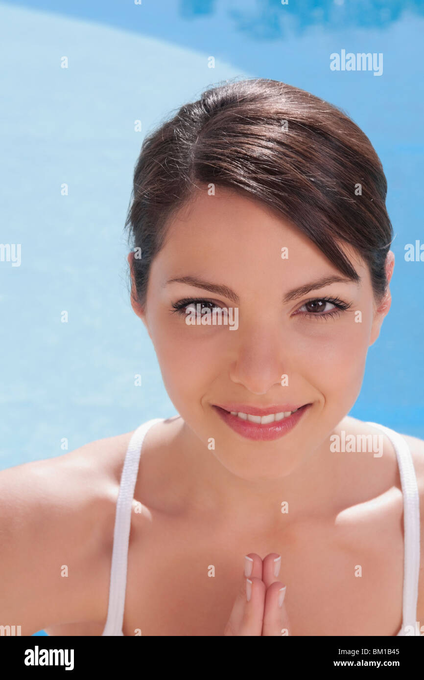 Woman practicing yoga and smiling Stock Photo - Alamy
