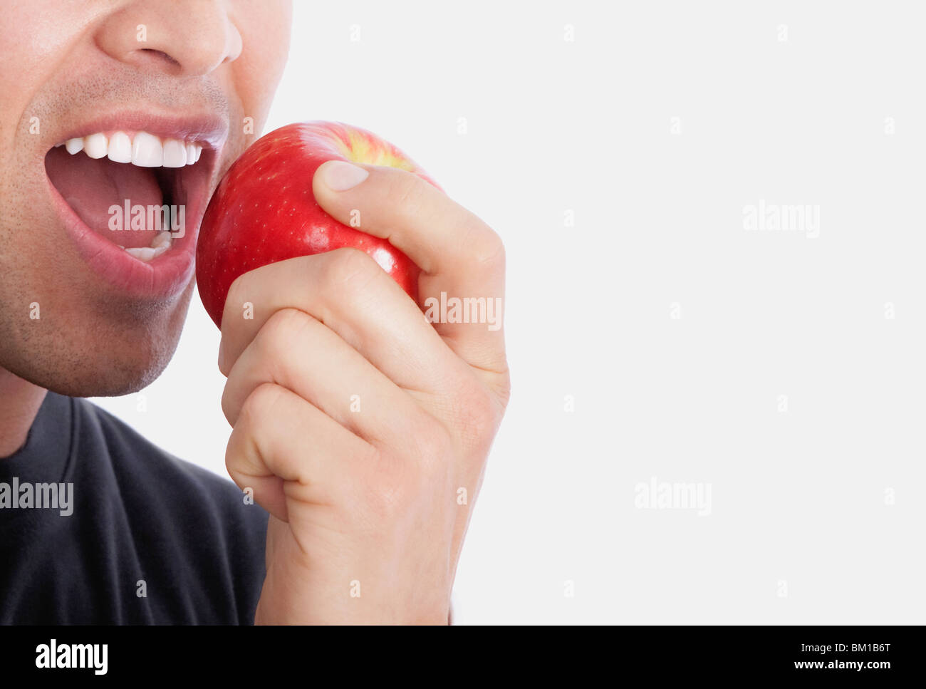 Man eating an apple Stock Photo - Alamy