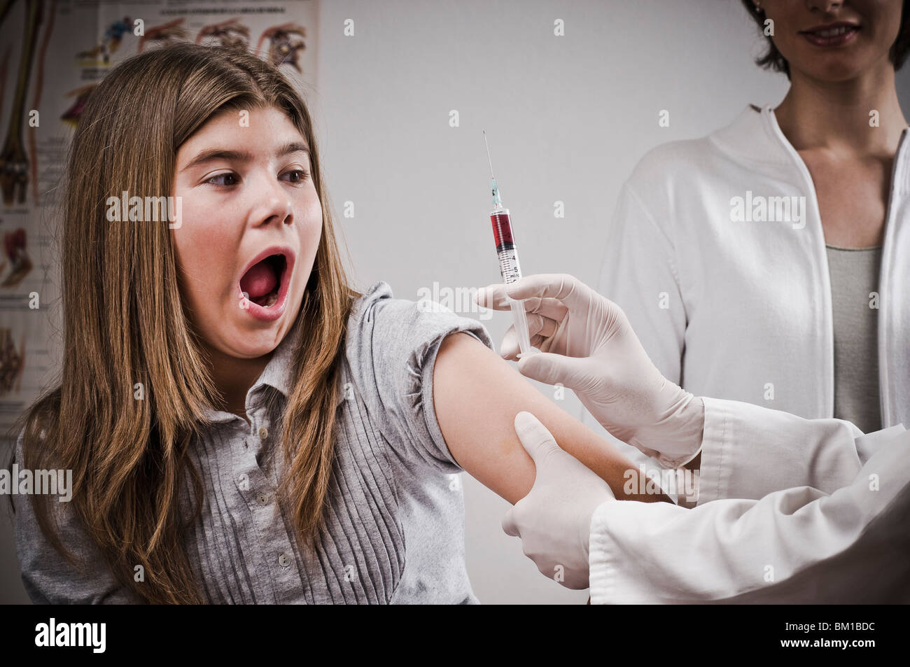 Girl fearing injection Stock Photo - Alamy