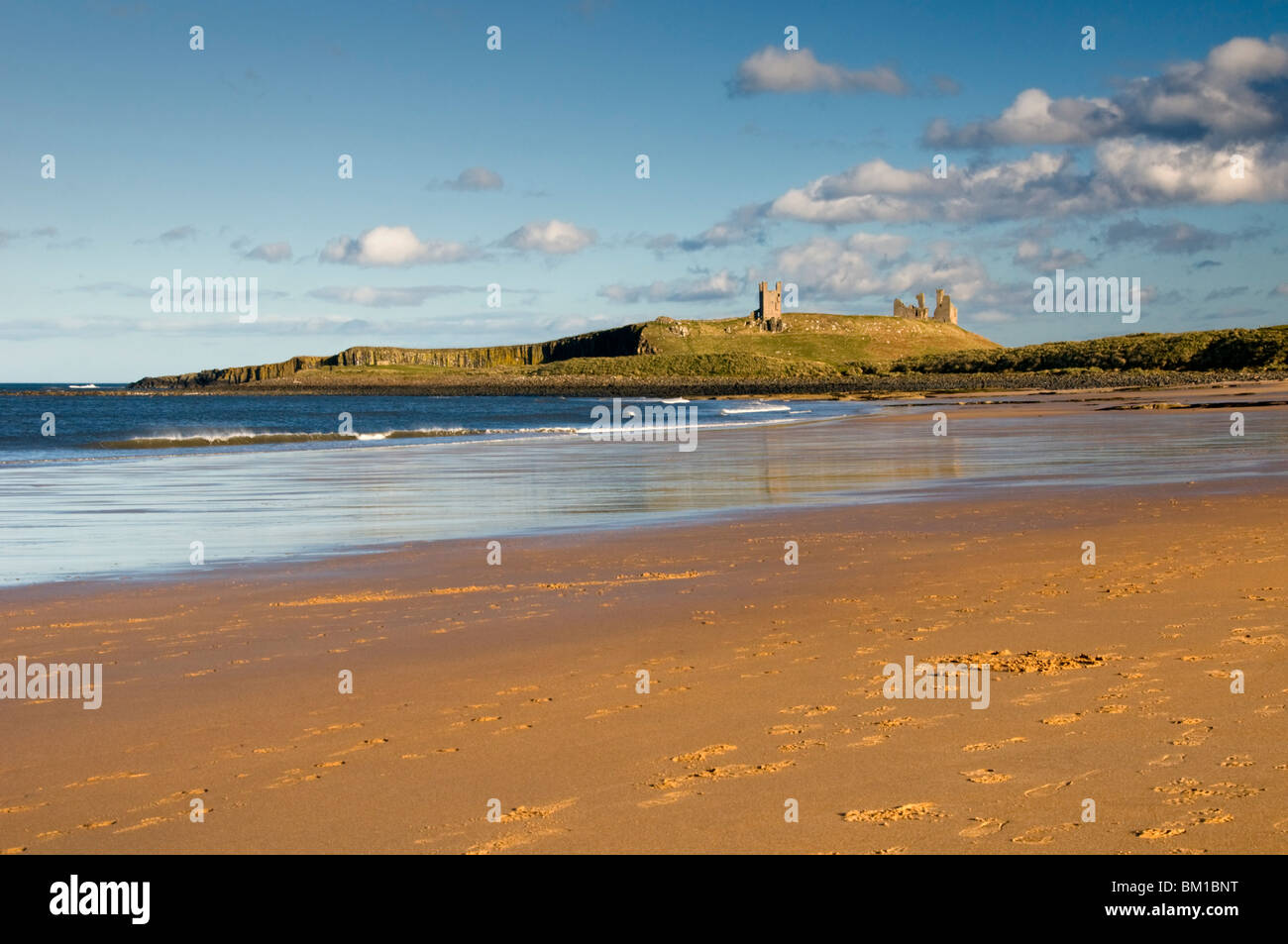 Dunstanburgh Castle viewed from Embleton Bay, Northumberland, England ...