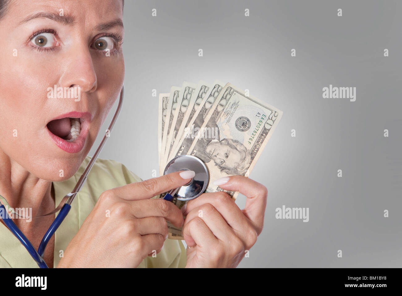 Doctor checking currency notes with a stethoscope Stock Photo - Alamy