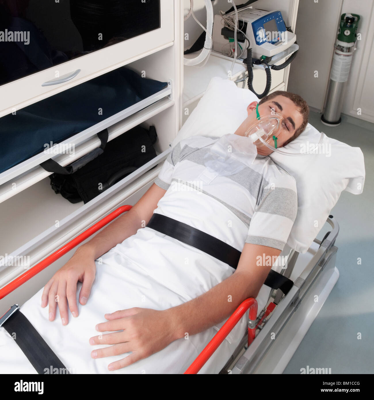 Patient in an ambulance Stock Photo - Alamy