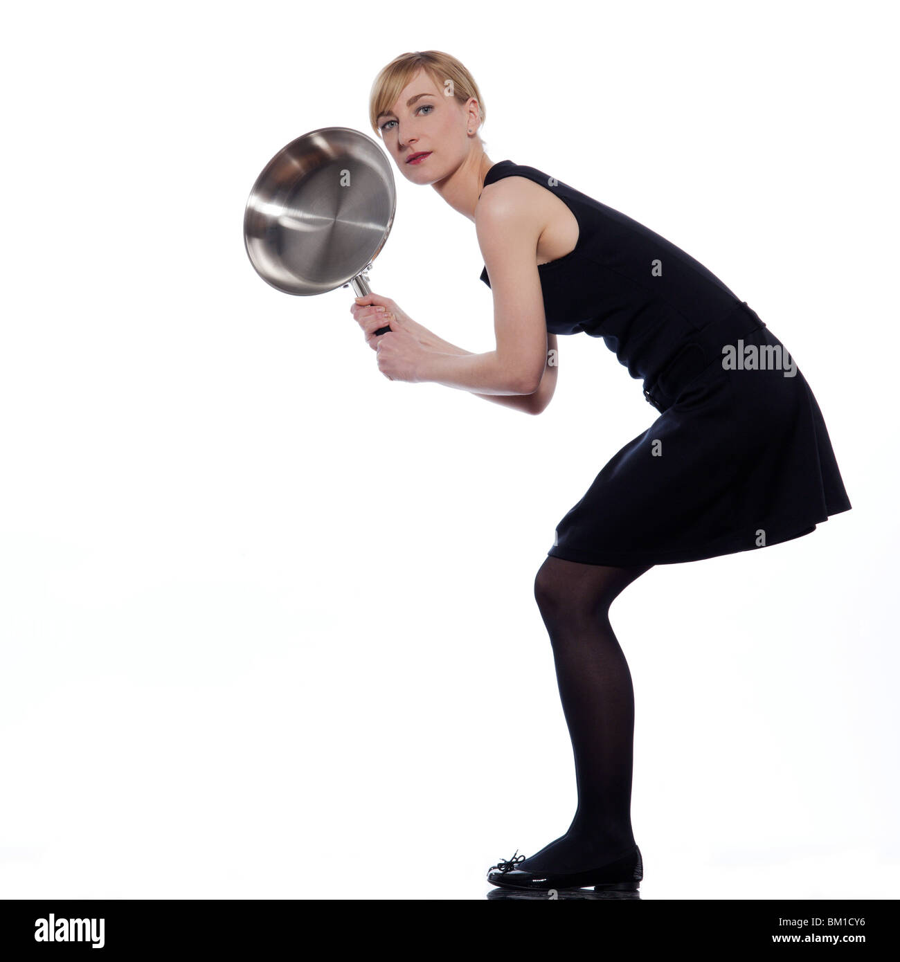 beautiful woman on studio white background holding a frying pan Stock ...