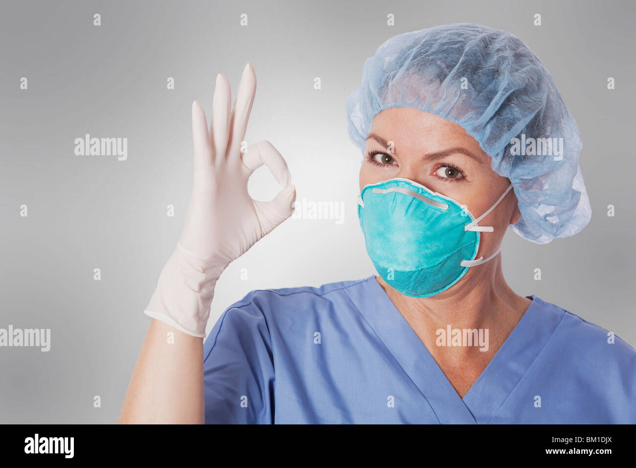 Female surgeon showing ok sign Stock Photo - Alamy