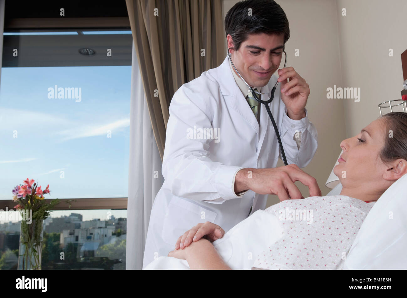 Doctor examining woman hi-res stock photography and images - Alamy