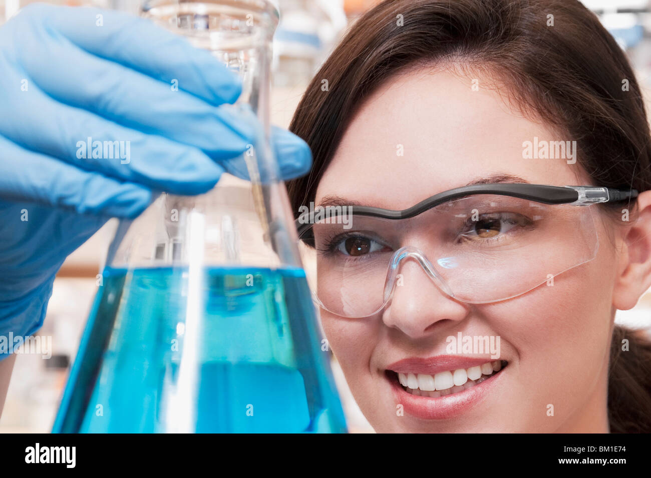 Female doctor holding a conical flask in a laboratory Stock Photo - Alamy