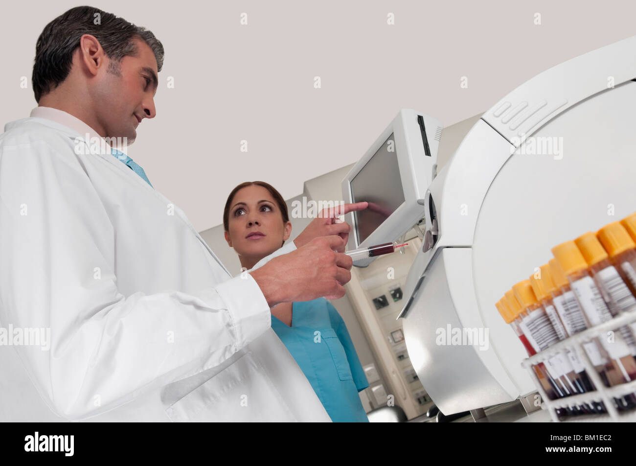 Lab technician testing blood samples in a laboratory hi-res stock ...