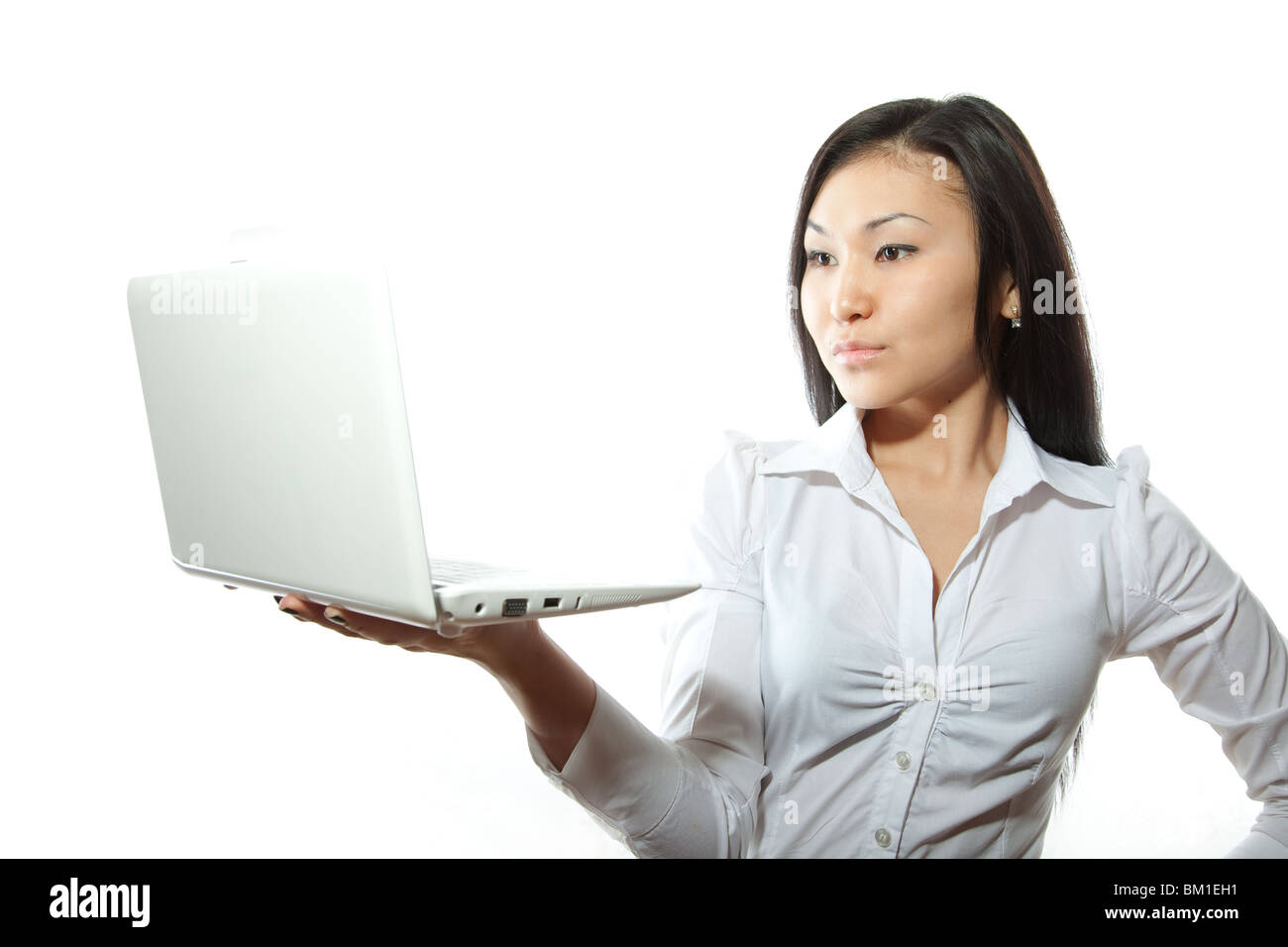 The young attractive girl holds the laptop on a hand Stock Photo - Alamy