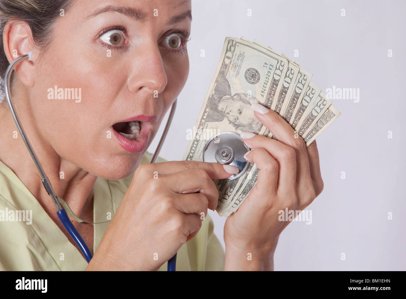 Doctor checking currency notes with a stethoscope Stock Photo - Alamy