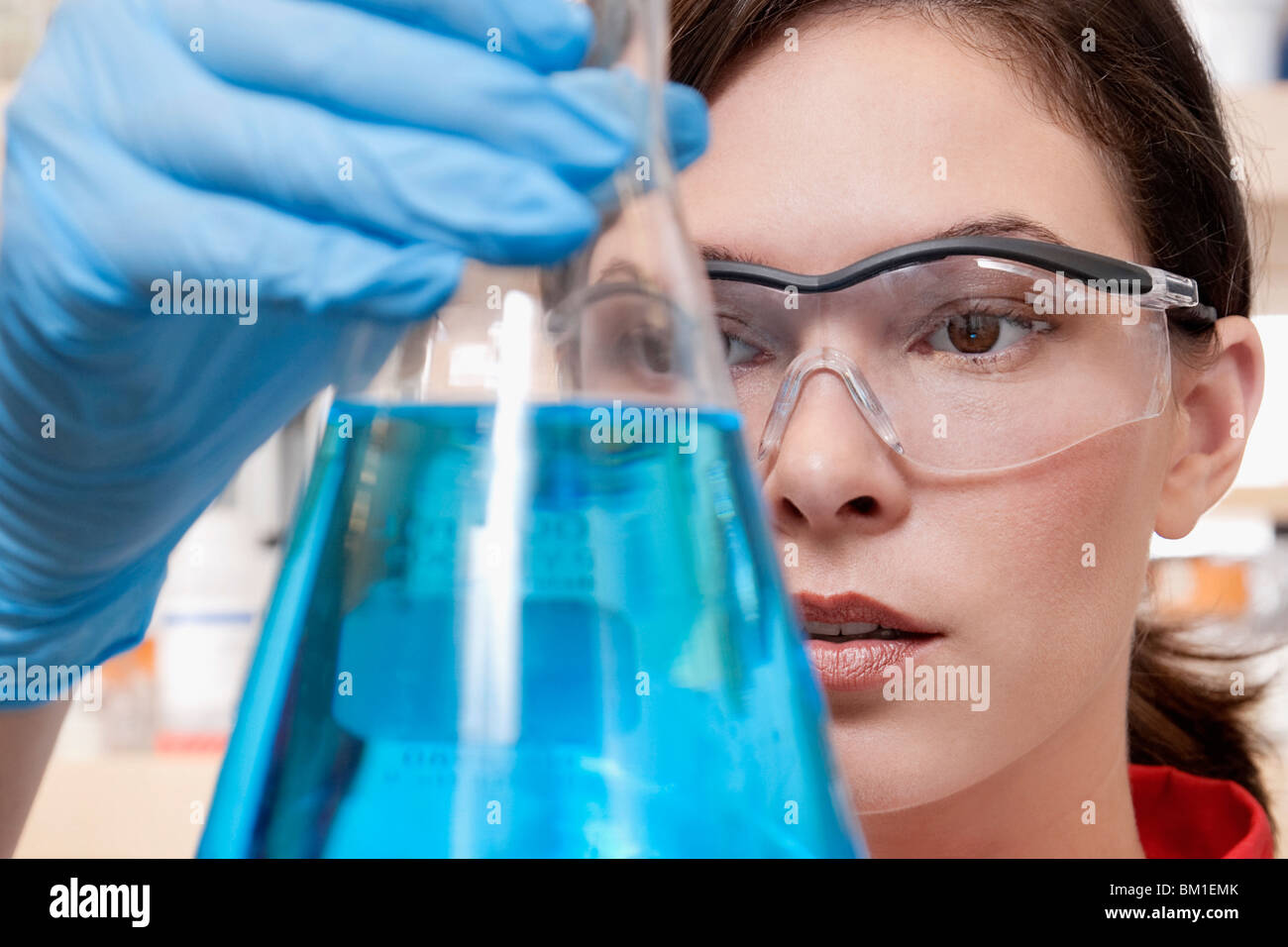 Close up of looking at liquid in conical flask hi-res stock photography ...