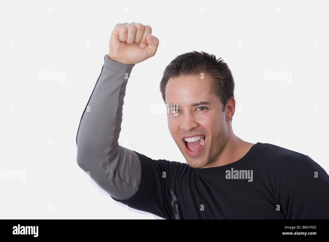 Portrait of a man clenching fist Stock Photo - Alamy