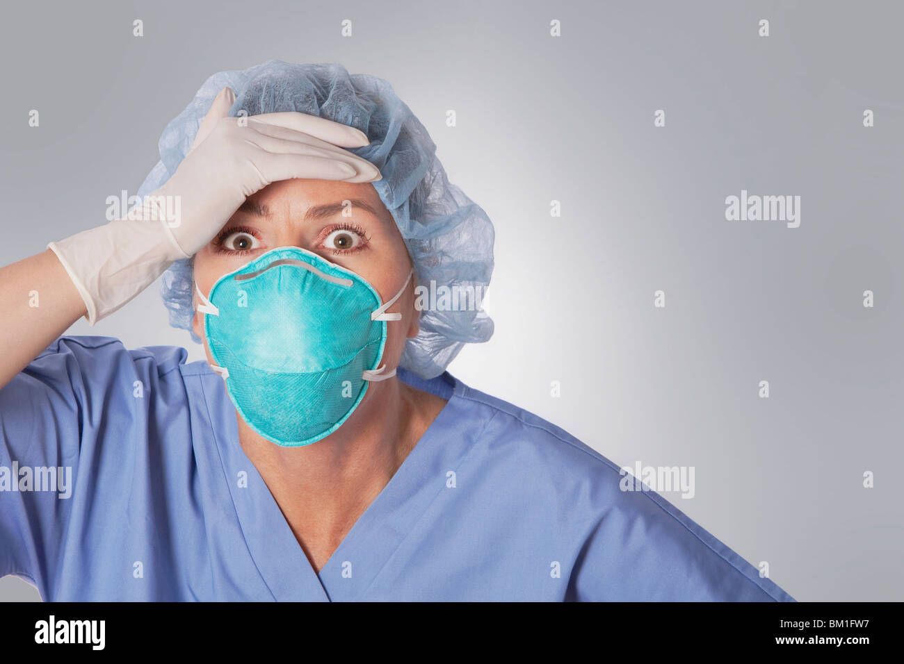 Female doctor looking shocked Stock Photo - Alamy