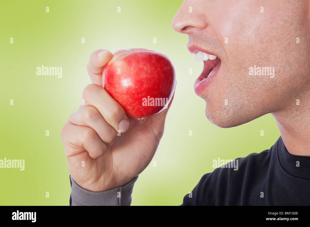 Man eating an apple Stock Photo - Alamy