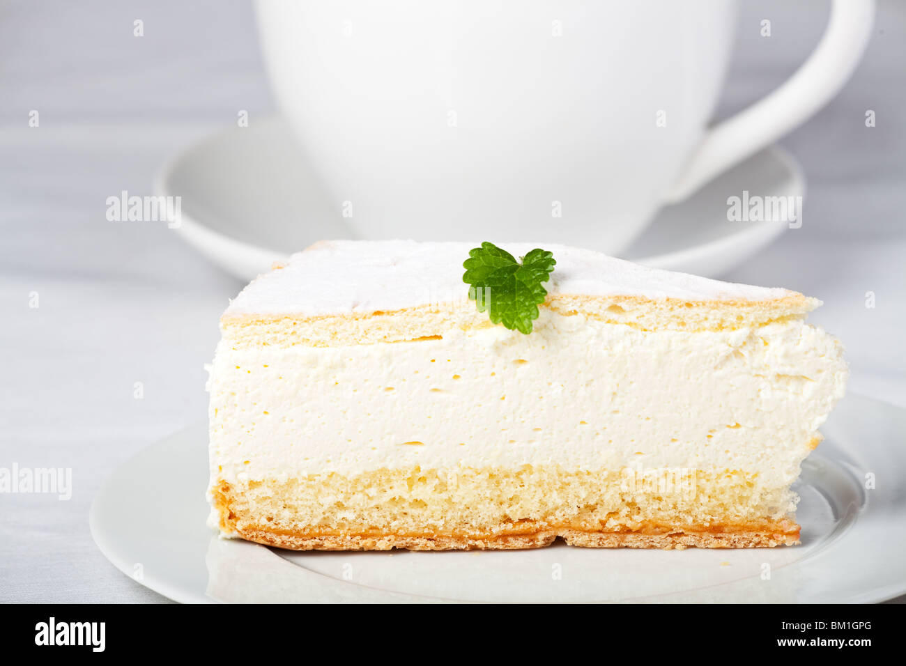 lemon balm leaf on a cream cake Stock Photo - Alamy