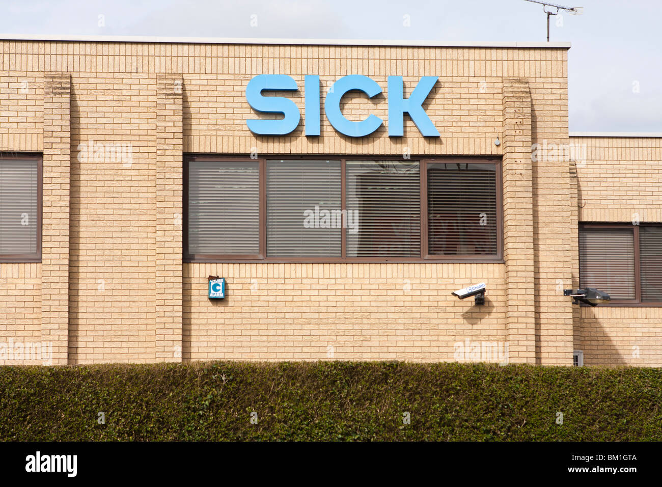 Office building with large Sick lettering on side Stock Photo - Alamy