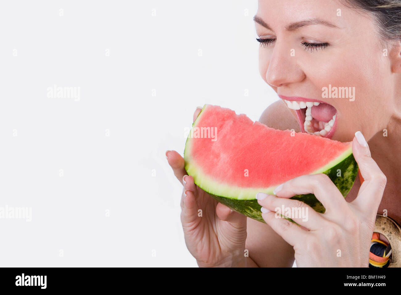 Woman eating watermelon Stock Photo - Alamy