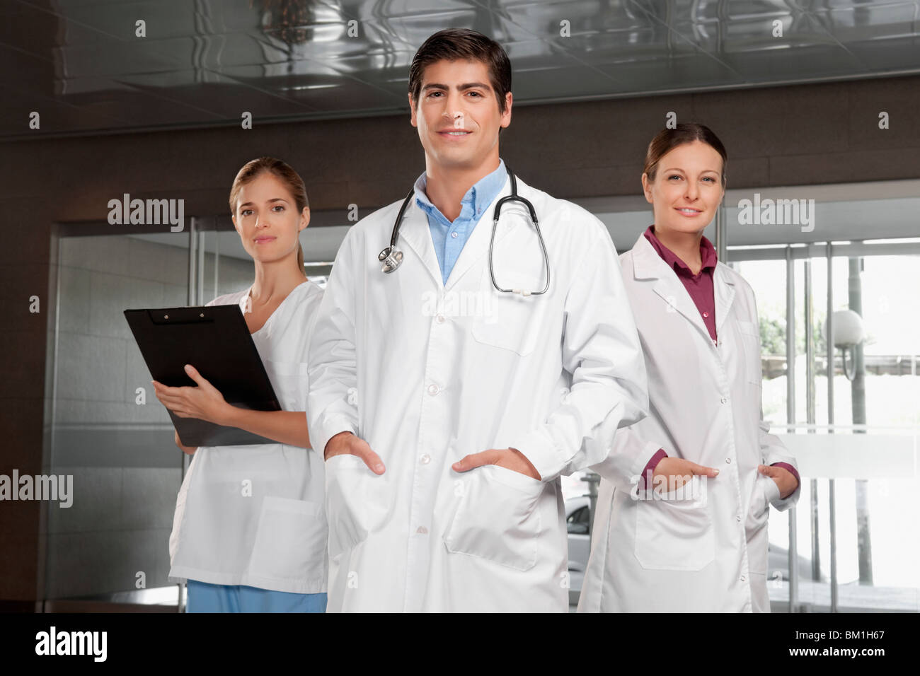 Doctors standing together Stock Photo - Alamy