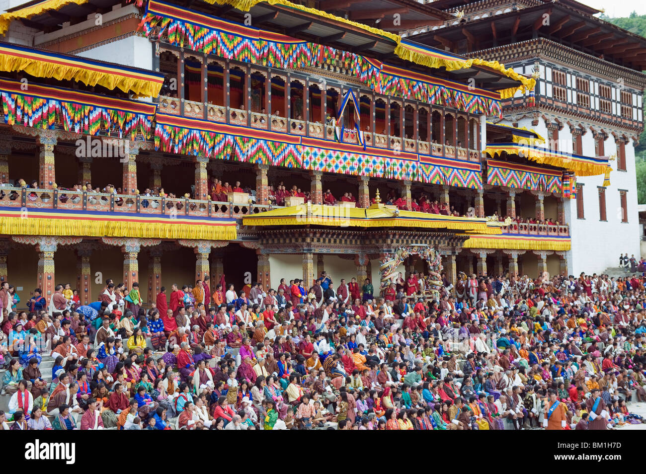 Spectators at Autumn Tsechu (festival) at Trashi Chhoe Dzong, Thimpu ...