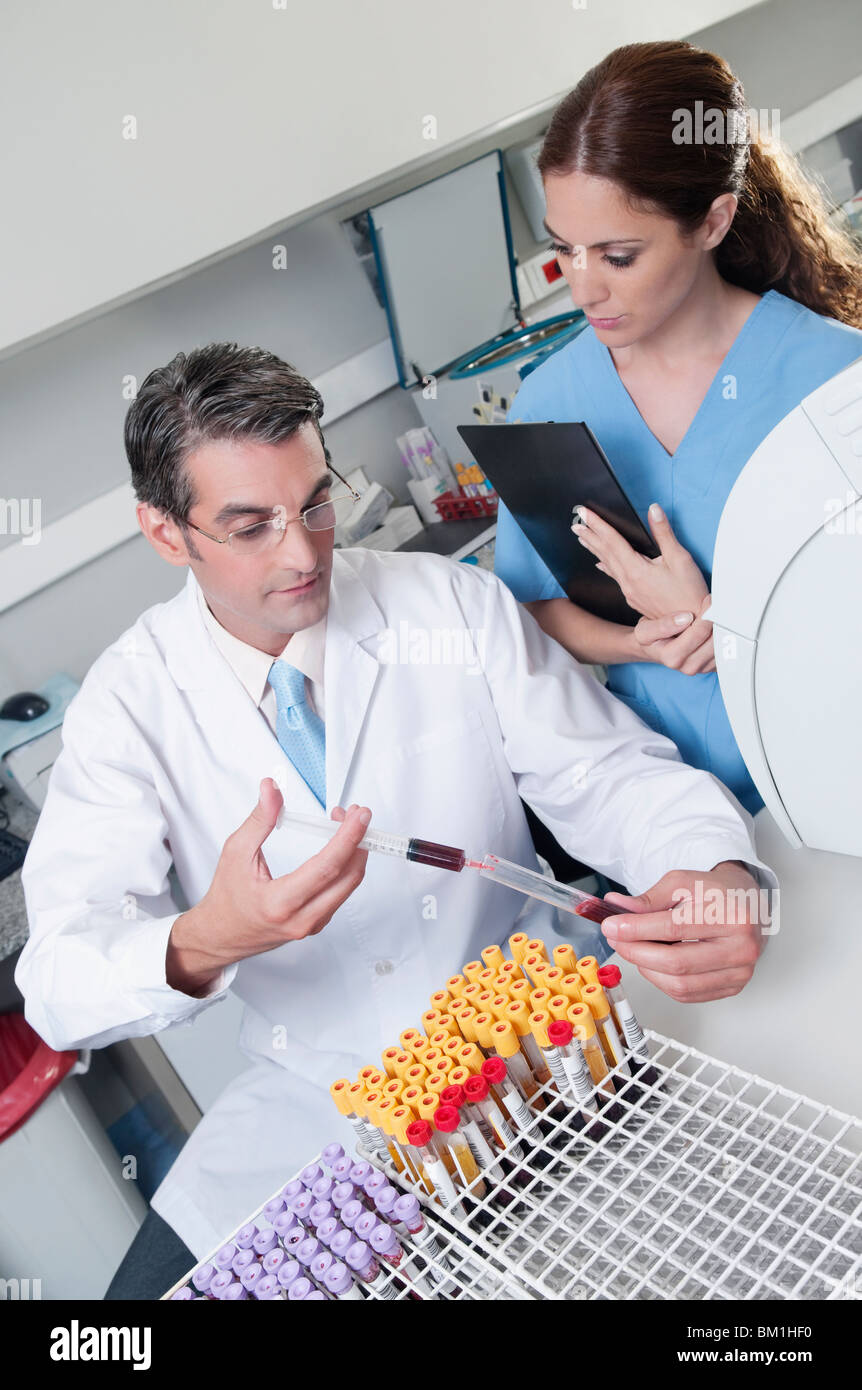 Blood syringe hi-res stock photography and images - Alamy