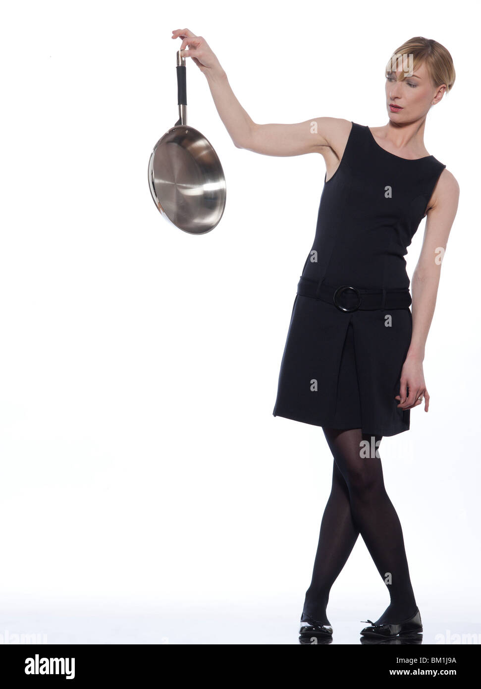 beautiful woman on studio white background holding a frying pan Stock ...