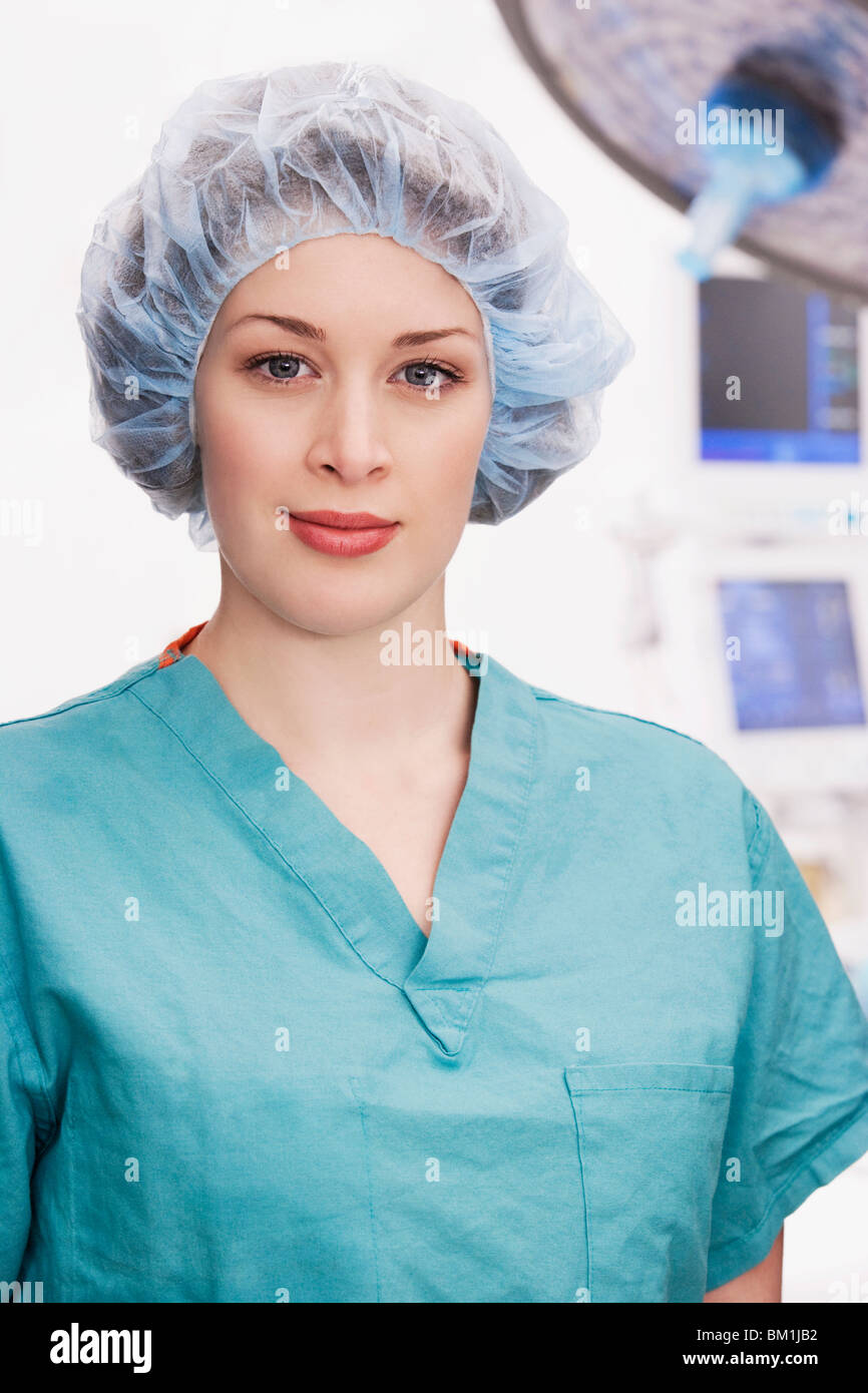 Portrait of a female doctor smirking Stock Photo - Alamy