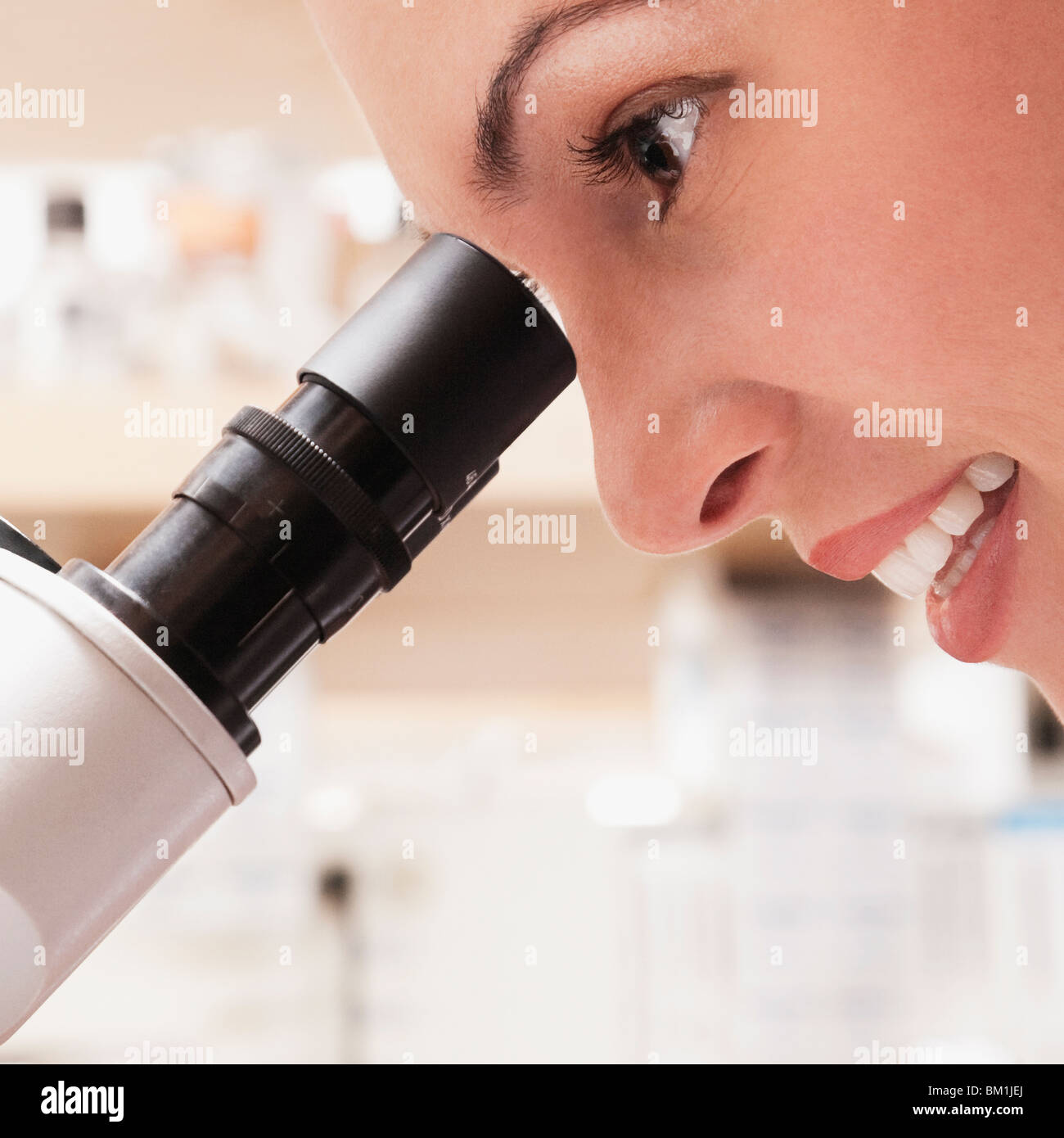 Female doctor working on a microscope in a laboratory Stock Photo - Alamy