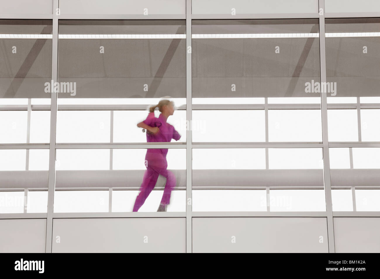 Female physician running late hi-res stock photography and images - Alamy