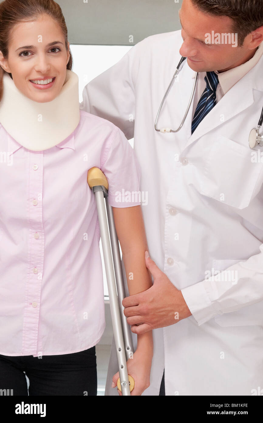 Doctor assisting patient walk hi-res stock photography and images - Alamy