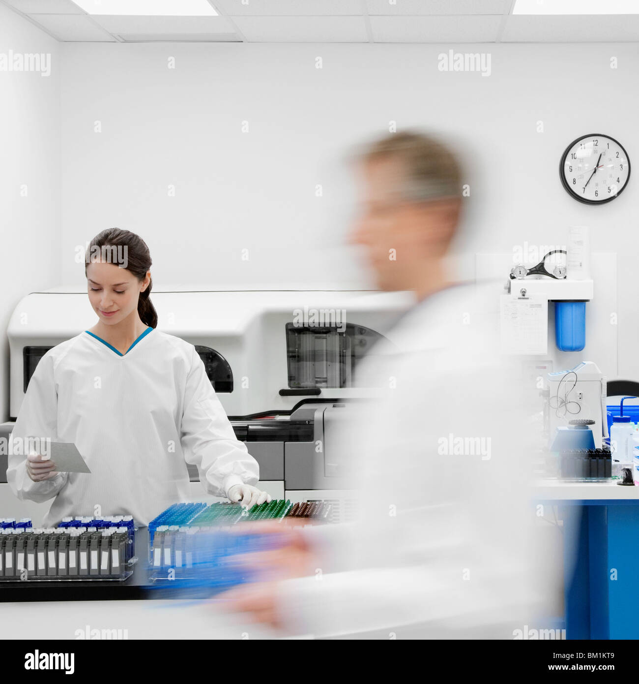 Female doctor examining a report in a laboratory Stock Photo - Alamy