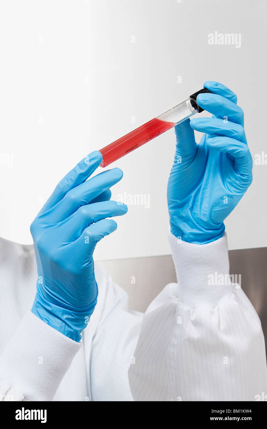 Doctor holding a medical sample in a laboratory Stock Photo - Alamy