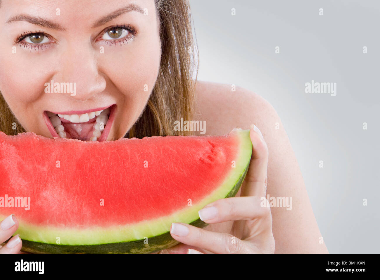 Woman eating watermelon Stock Photo - Alamy